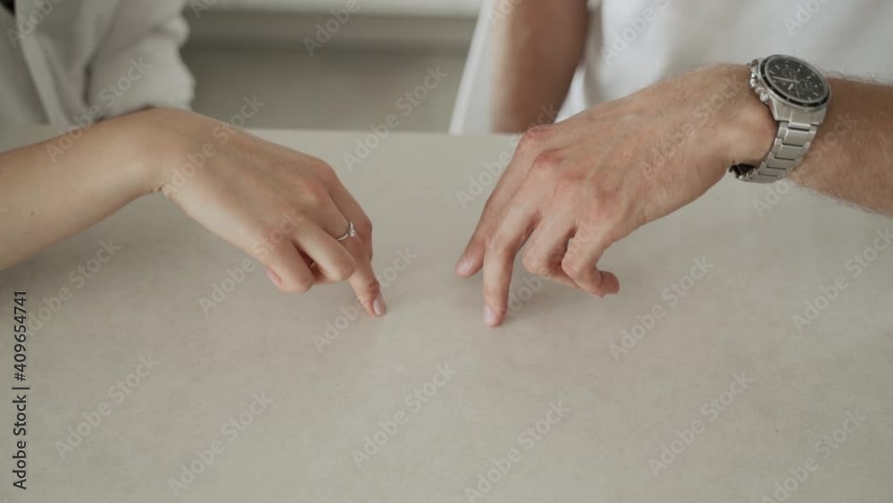 Close-up, caucasian fingers of man and woman hands go towards each ...