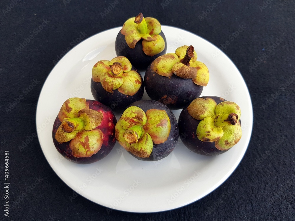 Mangosteen (Garcinia mangostana), also known as the purple mangosteen ...