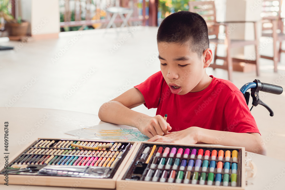 Fotka „Asian disabled child on wheelchair coloring art work,The skills ...