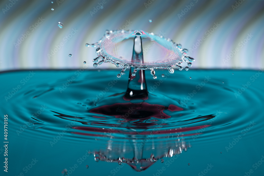 High resolution macro photograph of a colorful water drop splashing ...