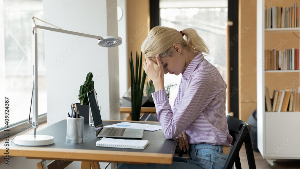 Tired female office employee feeling upset, stress while working at ...