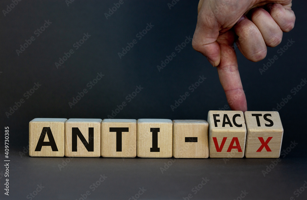 Foto de Anti-facts or anti-vax symbol. Doctor turns a cube, changes ...
