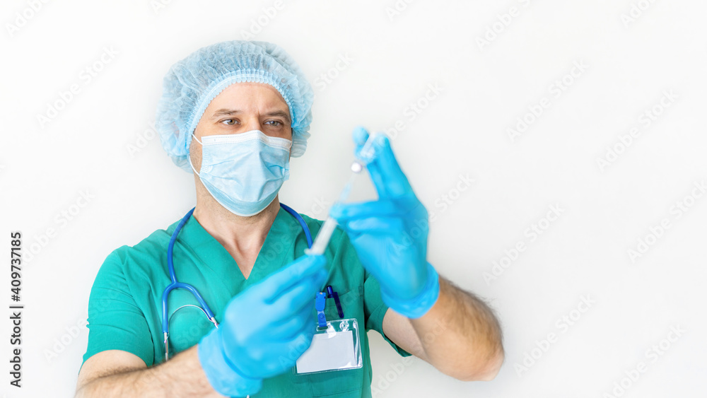 Covid-19 coronavirus vaccination concept. The doctor holds a syringe in ...