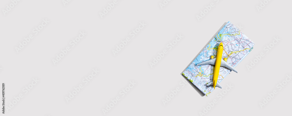 Travel theme with a miniature airplane and a map - flat lay Stock Photo ...