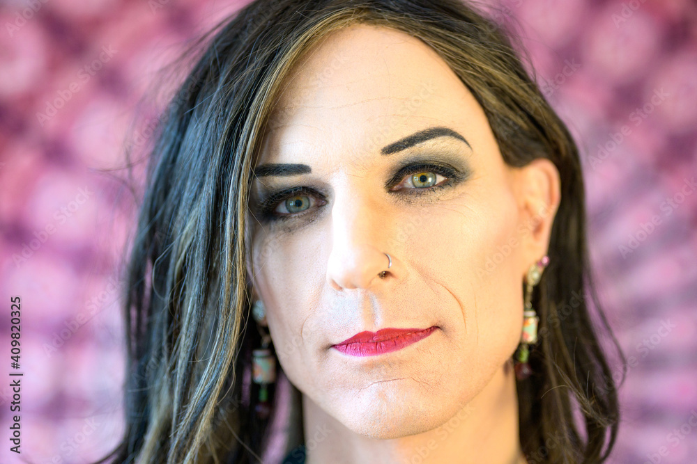 Portrait of a serious smiling transgender man Stock Photo | Adobe Stock