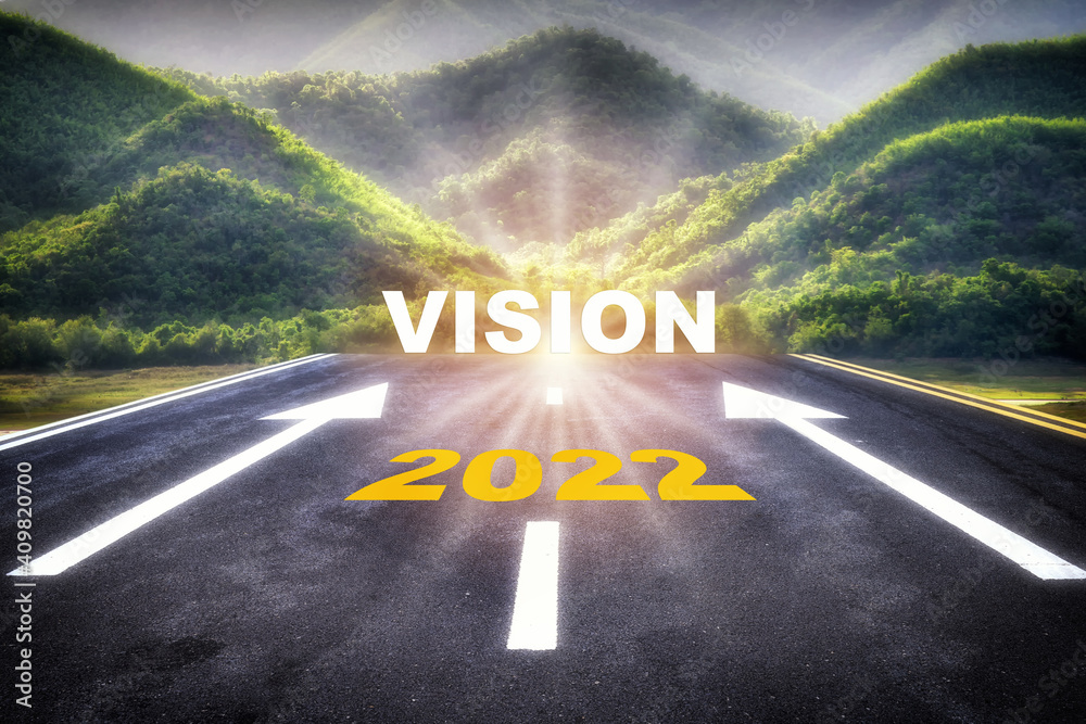 Road to 2022 vision on asphalt road surface with arrow sign on the ...