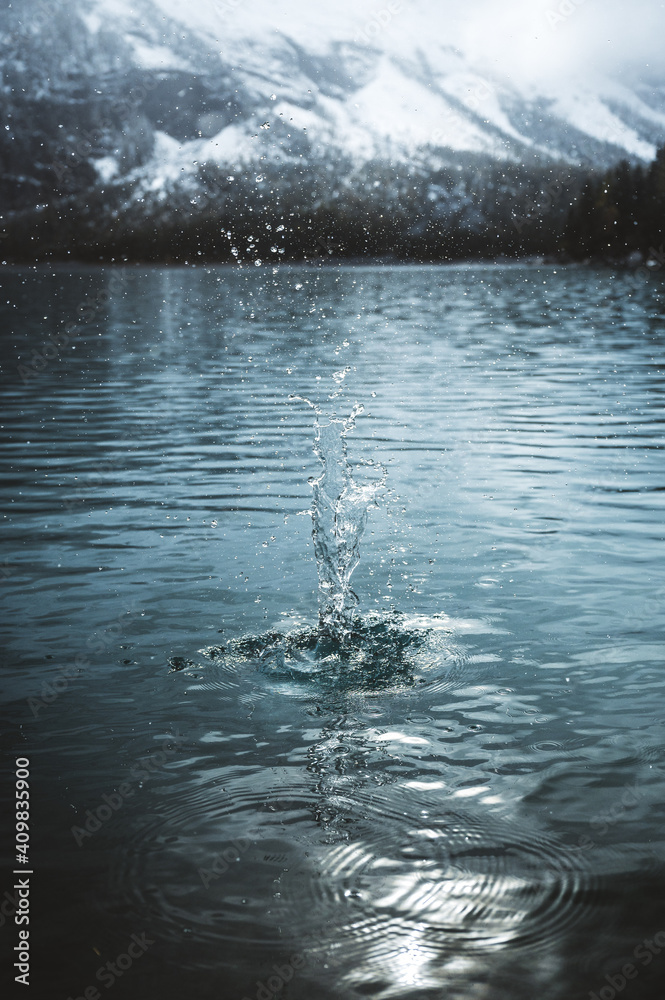splash of water after trowing a stone into Lake Oeschinesee Stock Photo ...