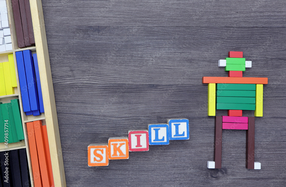 SKILL word written on wood block and Cuisenaire Rods on the table Stock ...