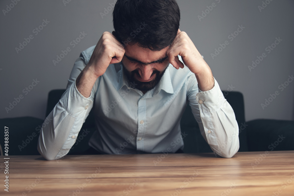 sad man hand in head Stock Photo | Adobe Stock