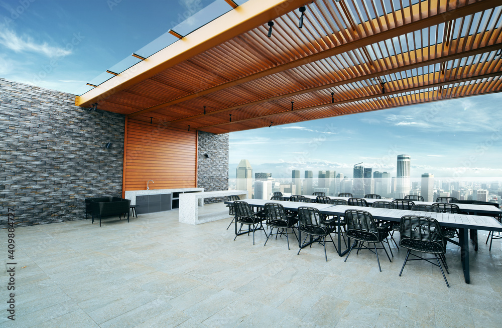Modern sky lounge and kitchen on roof top and stunning cityscape view ...
