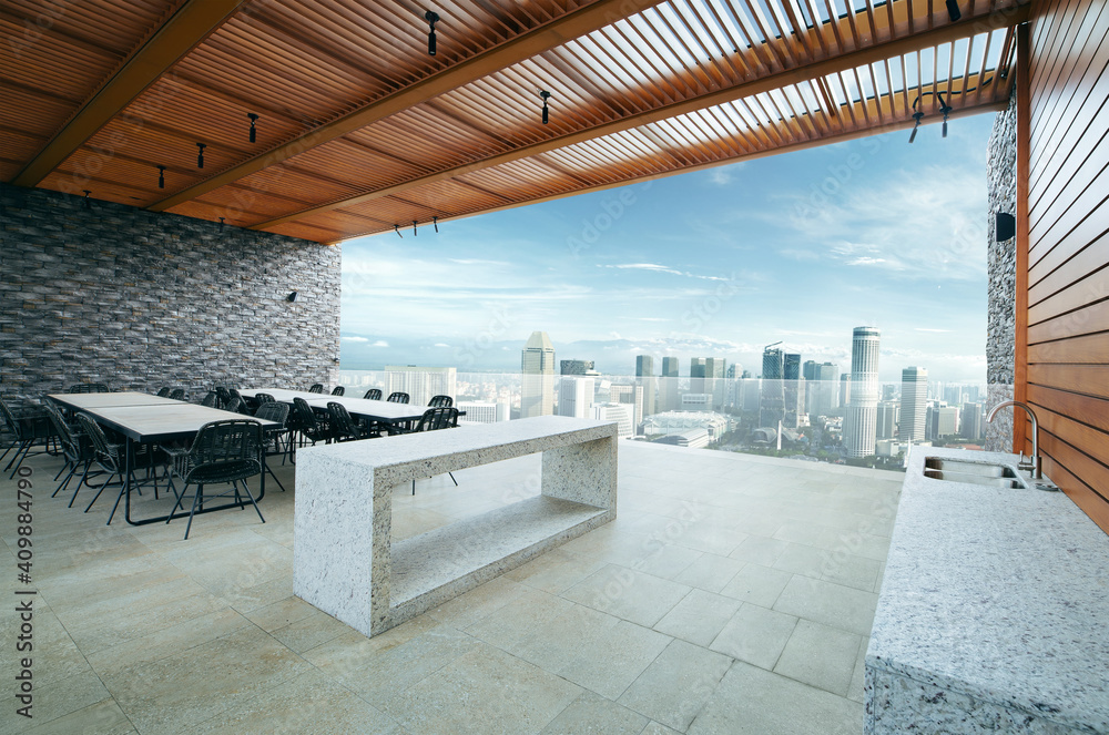 Modern sky lounge and kitchen on roof top and stunning cityscape view ...