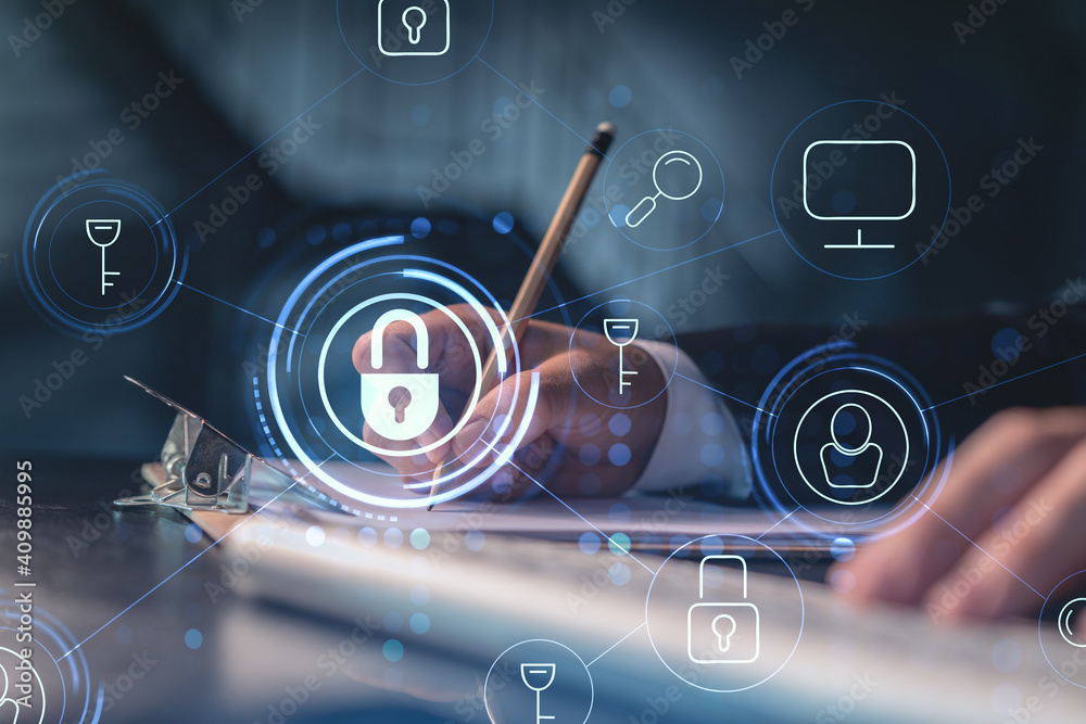 A programmer is taking notes of clients needs to protect cyber security ...