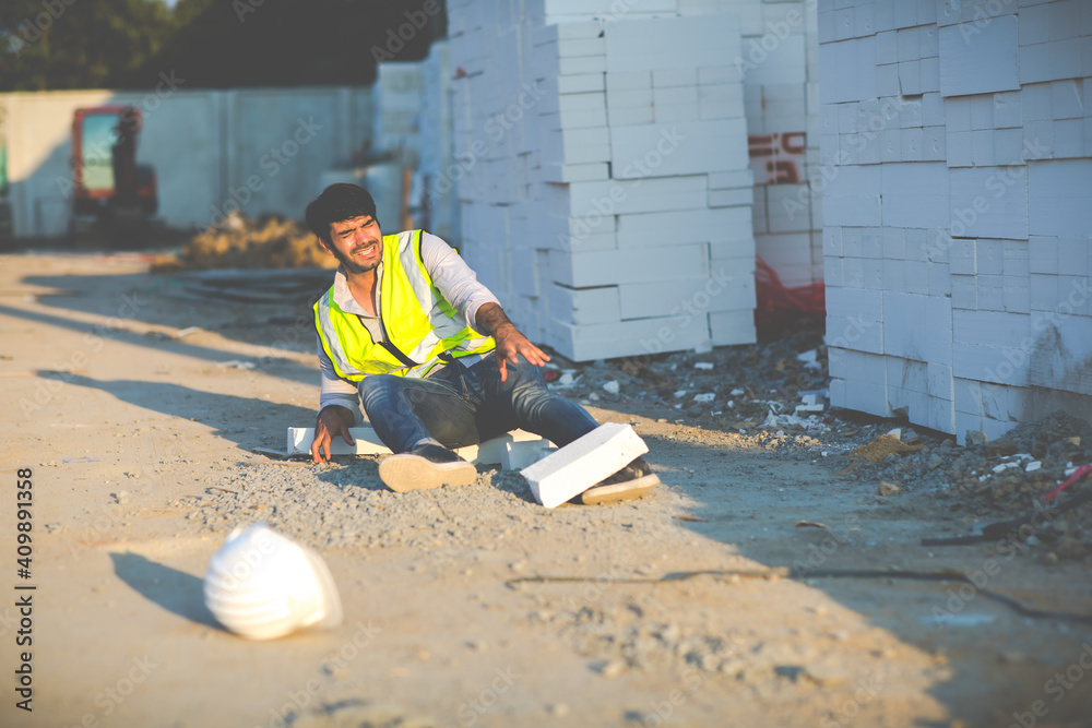 Construction worker has an accident lying on the floor while working in ...
