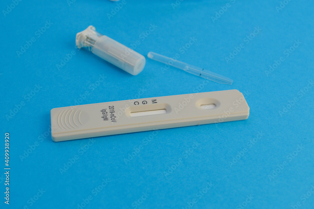 white test strip for the diagnosis of coronavirus infection. test on a ...