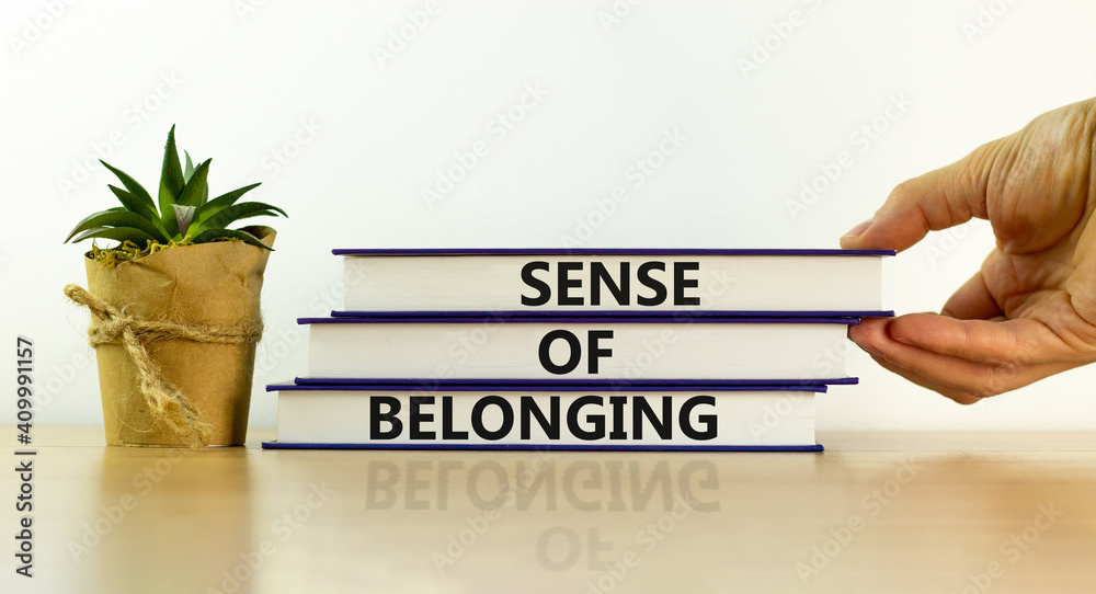 Sense of belonging symbol. Books with words 'sense of belonging' on ...