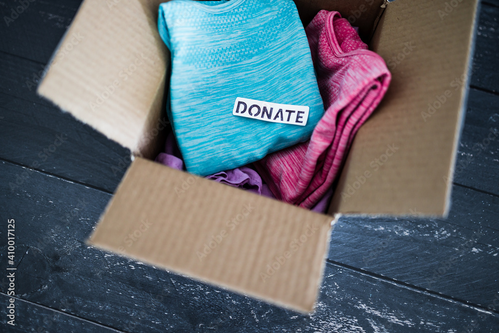 box with Donate label with second-hand items to be given away, charity ...