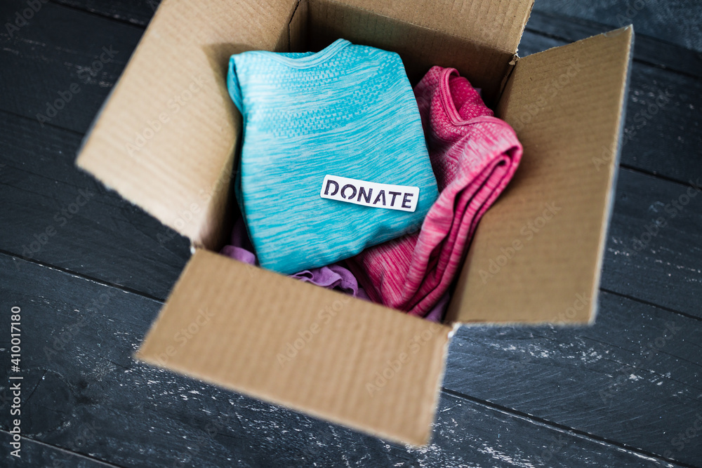 box with Donate label with second-hand items to be given away, charity ...