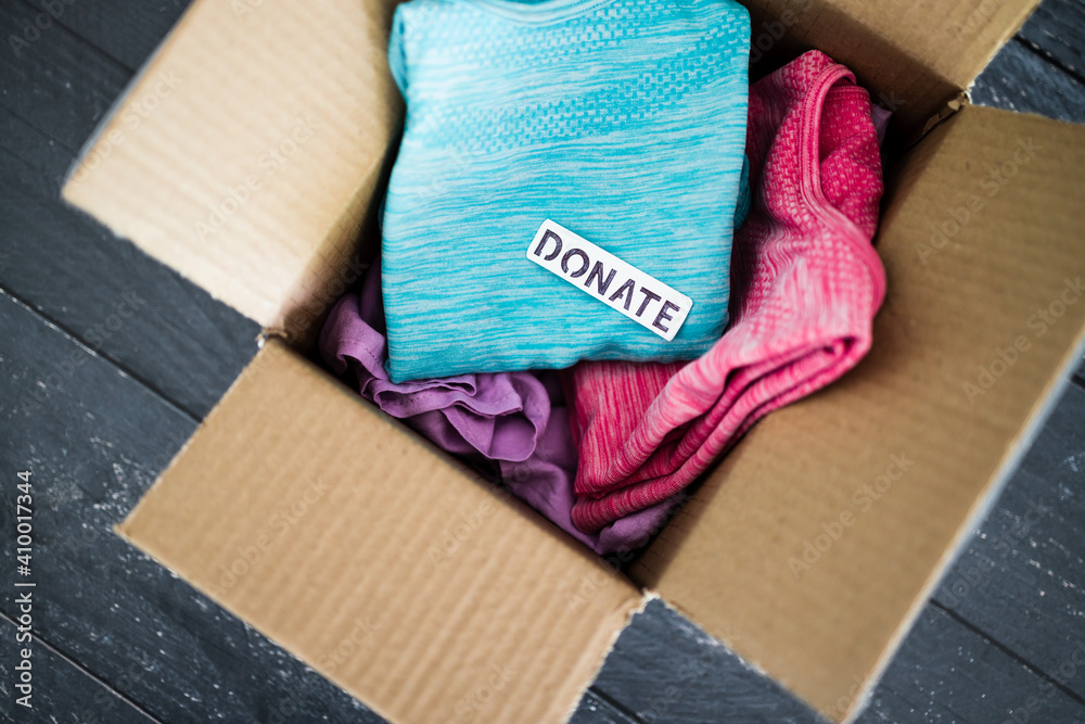 box with Donate label with second-hand items to be given away, charity ...