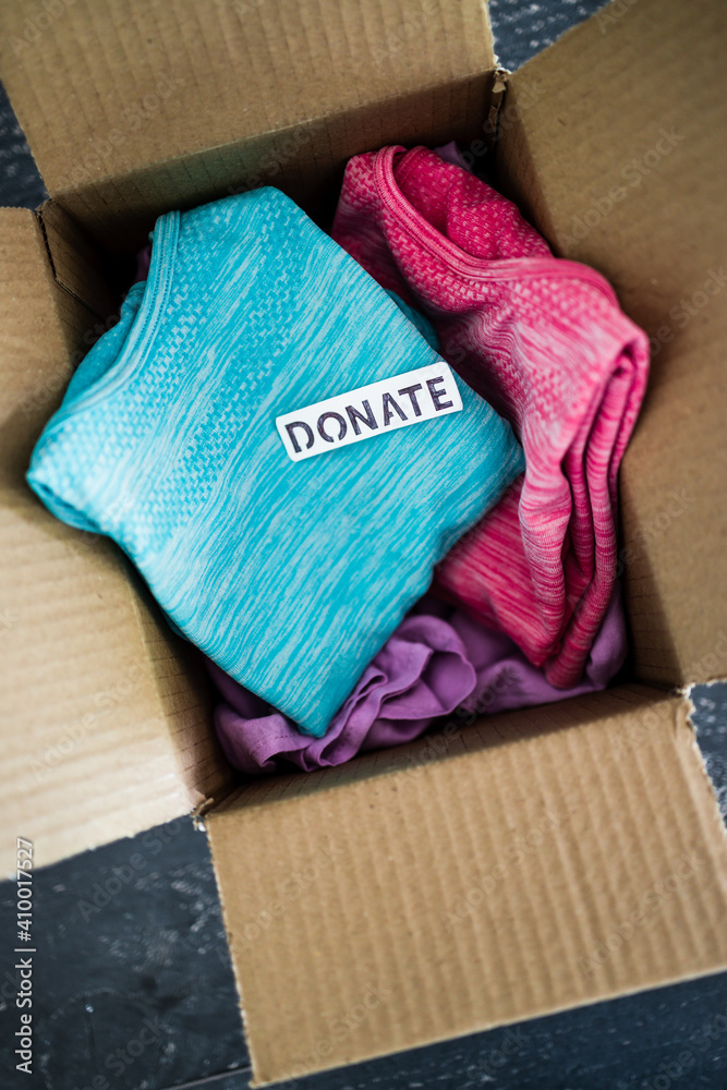 box with Donate label with second-hand items to be given away, charity ...