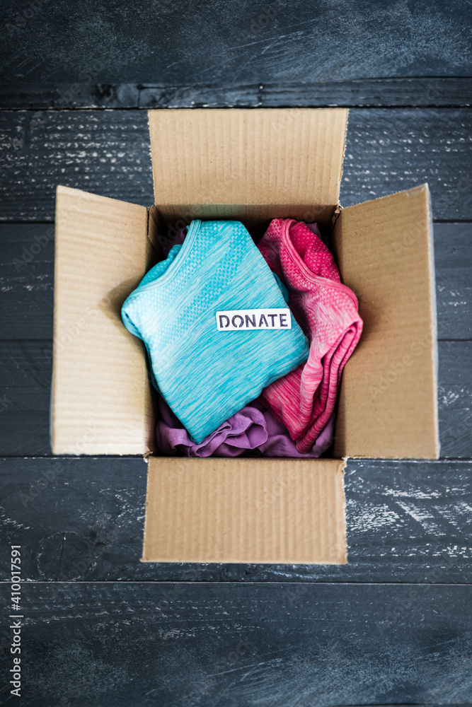 box with Donate label with second-hand items to be given away, charity ...