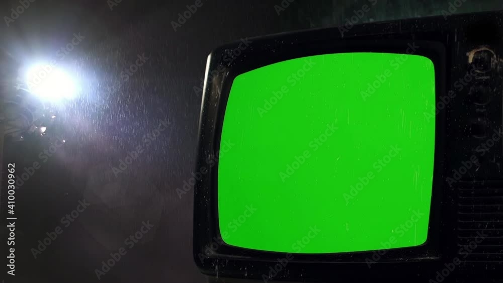 Old TV Set Green Screen in the Rain. Zoom In. You can replace green ...