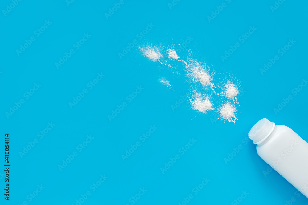 Jar with baby powder from diaper rash on a blue background, flatley ...