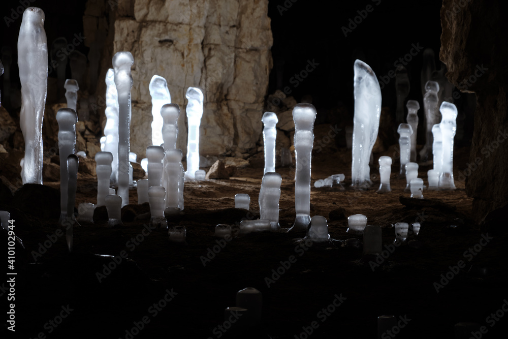 Ice stalactites in an abandoned quarry mine. Travel under the ...