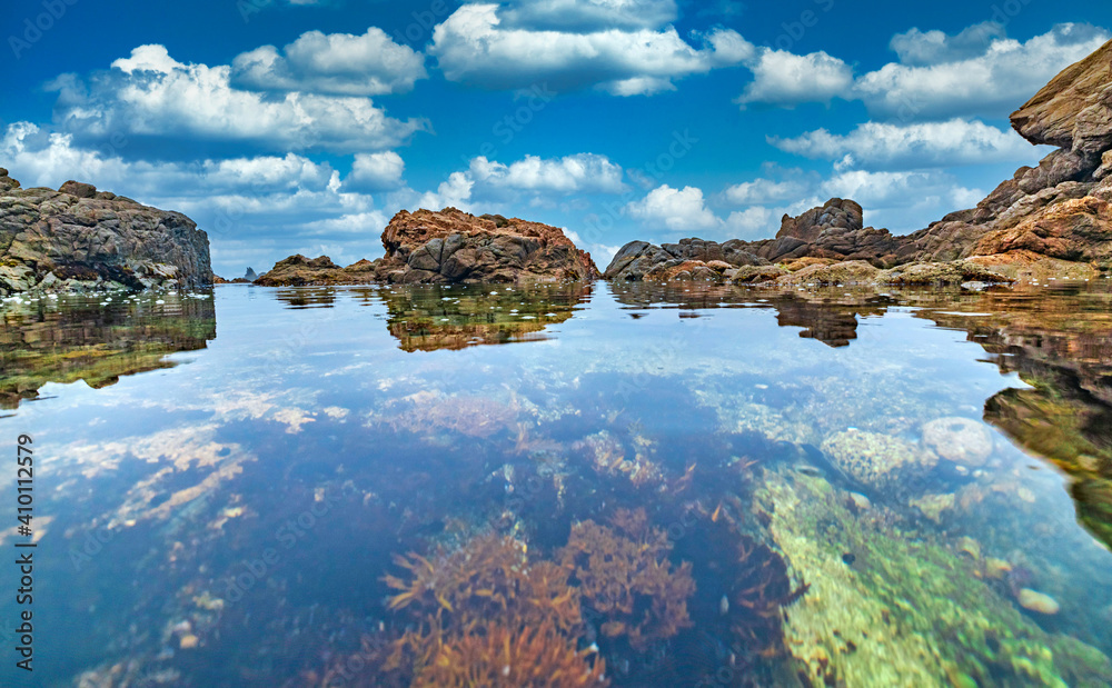 Beautiful seascape, ocean views, rocky coast, sunlight on the horizon ...