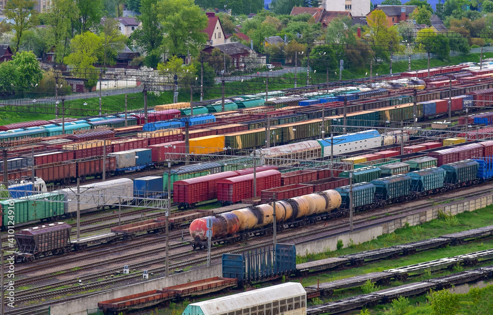 Aerial view of railway yard with freight rail wagons. Cargo trains with goods on railroad ...