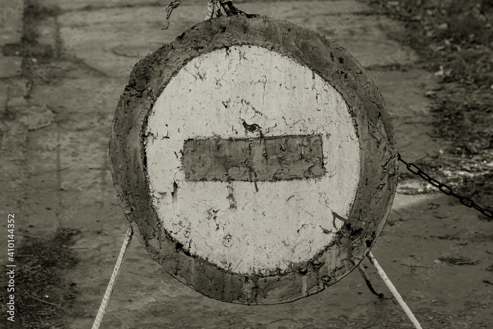 Old cracked shabby road sign Passage closed. Brick is a road sign that ...