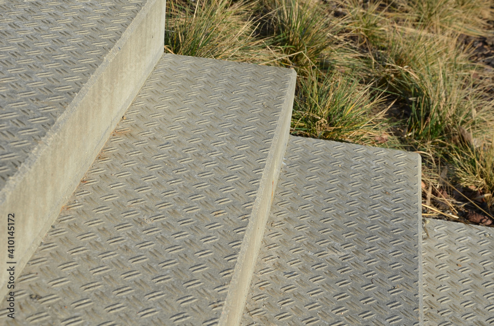 concrete monolith staircase with the texture of extruded ribbed ...