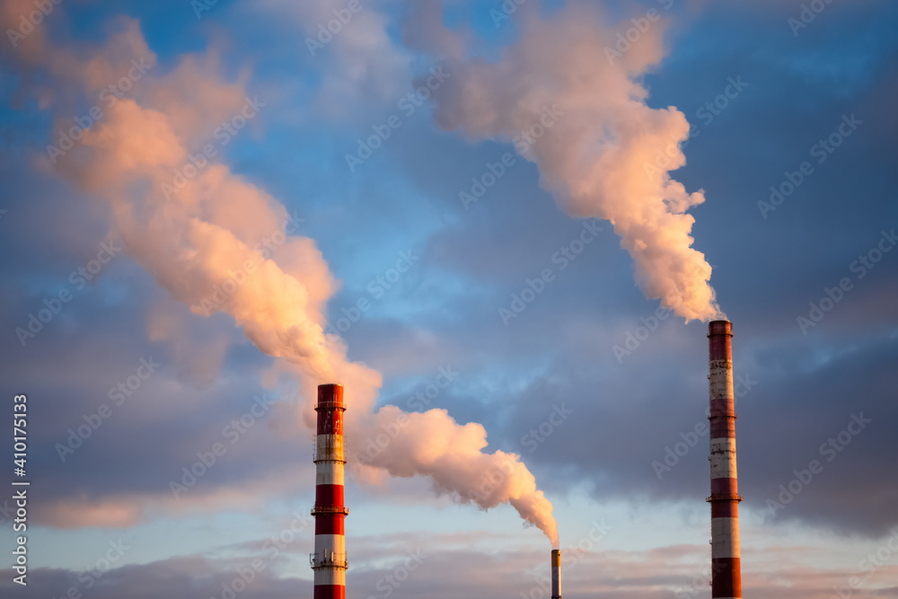 Toxic smoke clouds coming out of factory chimney at sunset. Air ...