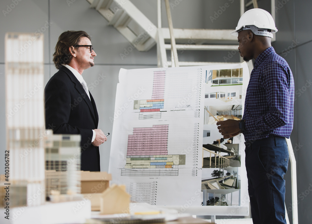 A man African American and Leadership caucasian architects standing ...