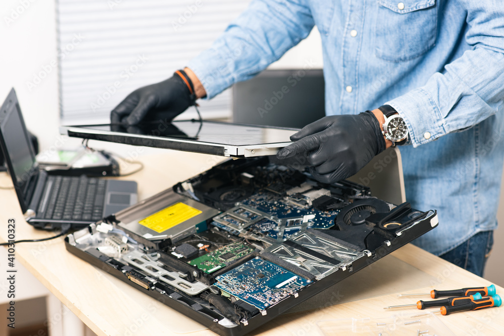 repairing the broken computer Stock Photo | Adobe Stock