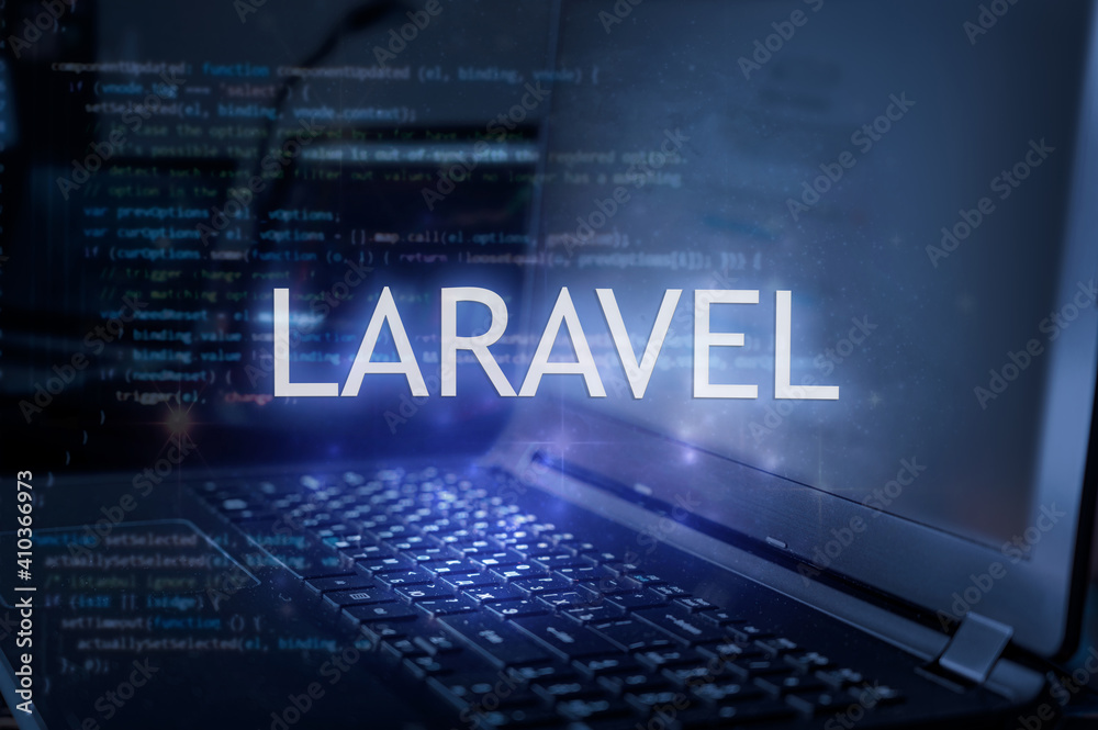 Laravel inscription against laptop and code background. Technology ...