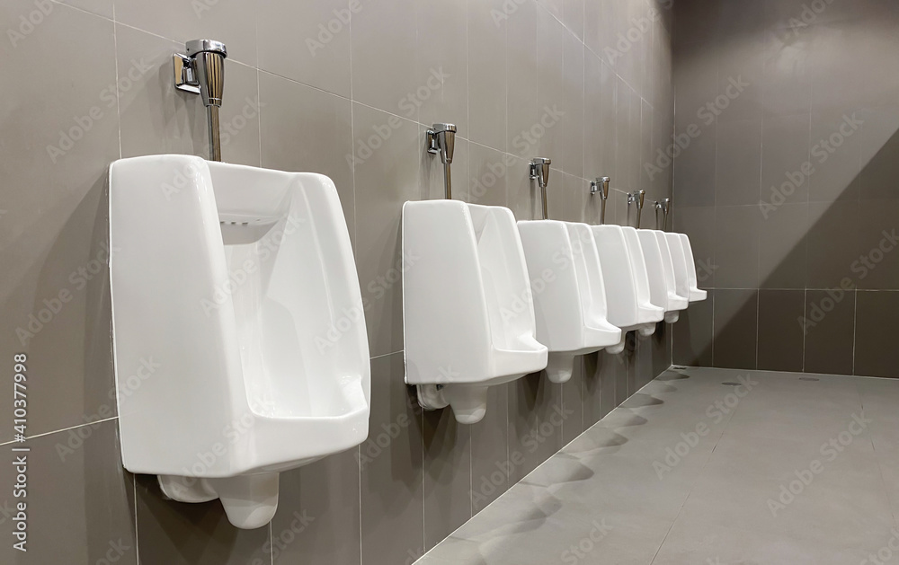 Men's white urinals design, Close up row of outdoor urinals men public ...