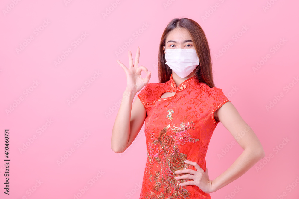 Beautiful young Chinese women use face masks to protect against dust ...
