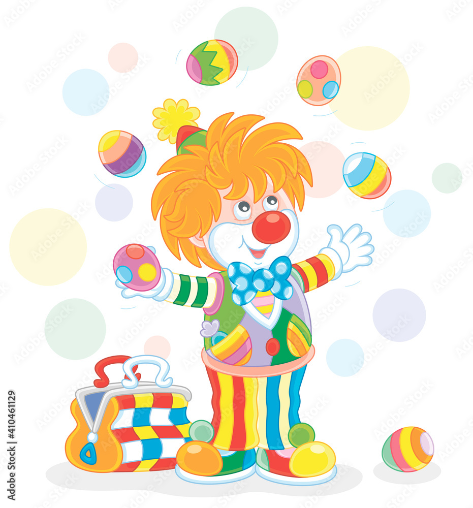 Funny and friendly smiling clown in a colorful comic suit juggling with ...