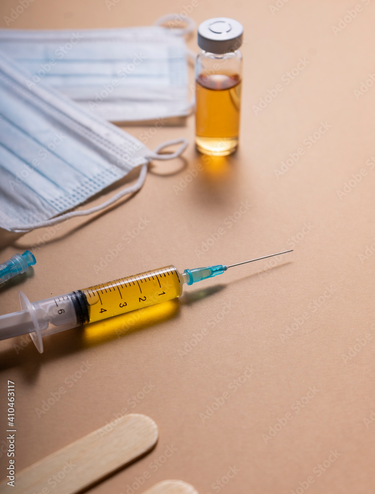 selective focus. a single-use syringe with a vaccine, a serum from the ...