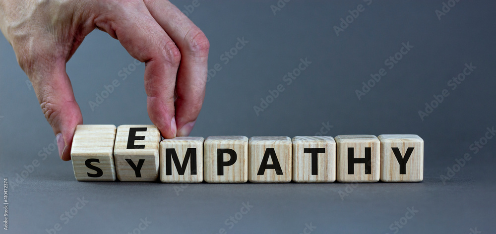 Sympathy or empathy symbol. Businessman turns wooden cubes and changes ...