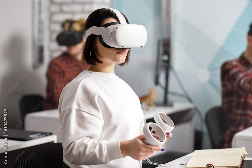 team of four creative engineers working with virtual reality, young ... team of four creative engineers working with virtual reality, young ...