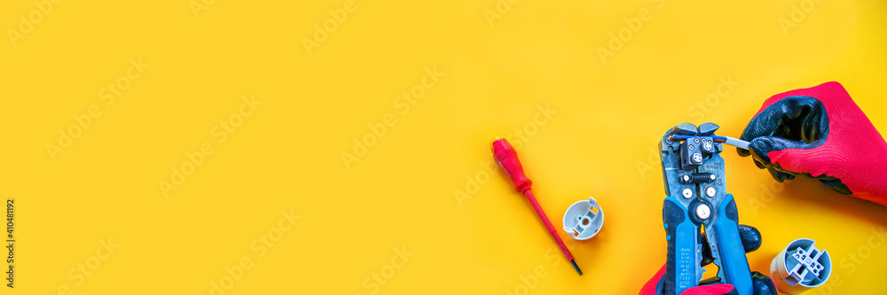 Electrical installation measuring instruments tools on a yellow ...