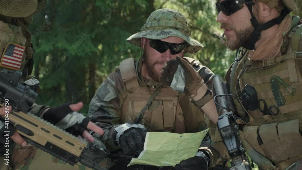 Handheld medium closeup of squad of professional disguised scouts with ...