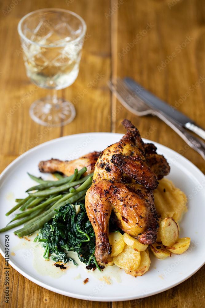Roasted poussin with potatoes, mashed swede, green beans and creamy ...