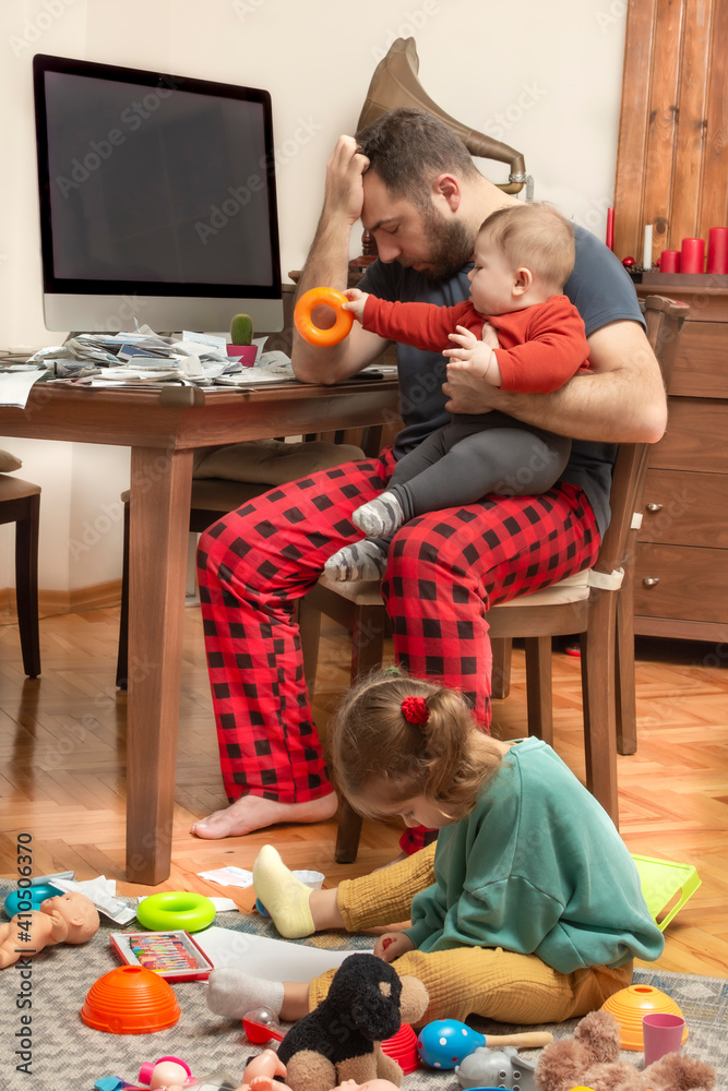 Stressed unemployed man hold bills in hand. Father of two child have ...
