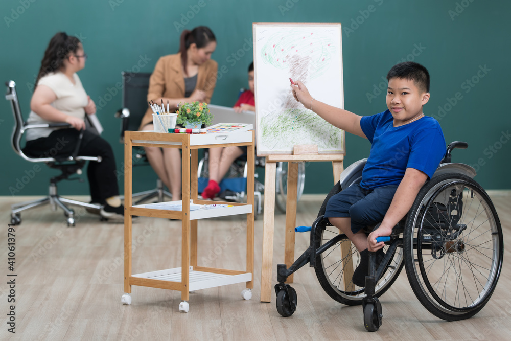Child In Wheelchair In Classroom