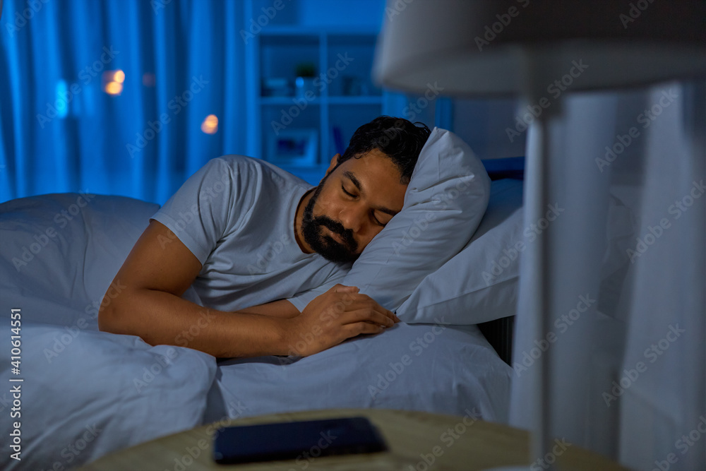 Foto De People Bedtime And Rest Concept Indian Man Sleeping In Bed foto-de-people-bedtime-and-rest-concept-indian-man-sleeping-in-bed