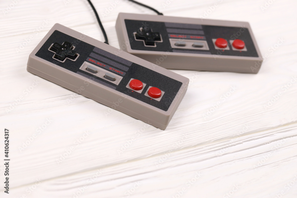 KHARKOV, UKRAINE - DECEMBER 27, 2020: Two old gamepads for 8-bit video ...
