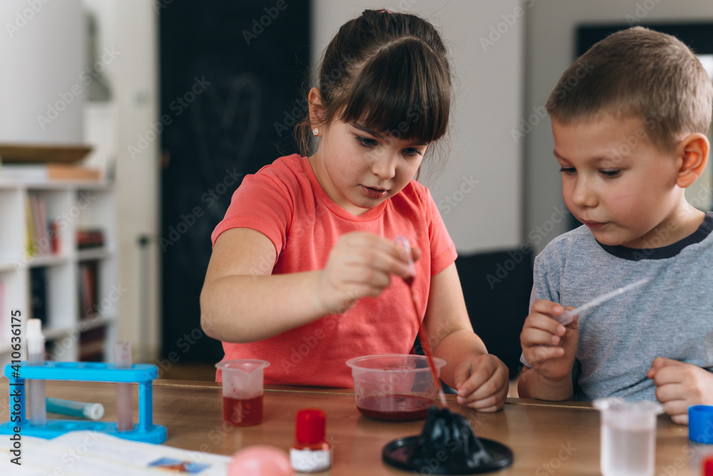 brother and sister do chemical experiments at home Stock Photo | Adobe ...
