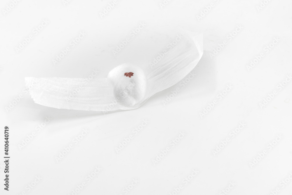 Close up cotton swabs to cover the wound with small blood stains. Blood ...